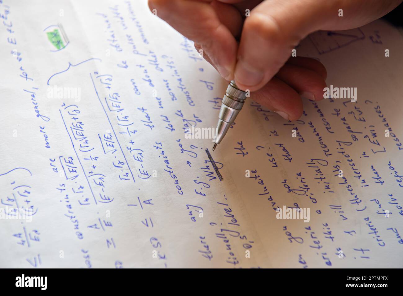 Student writing mathematical calculations on paper, closeup Stock Photo ...