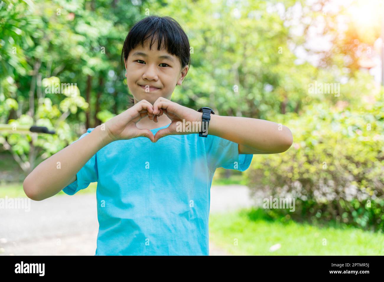 Portrait of happy child's hands gesture in heart shape showing love and ...