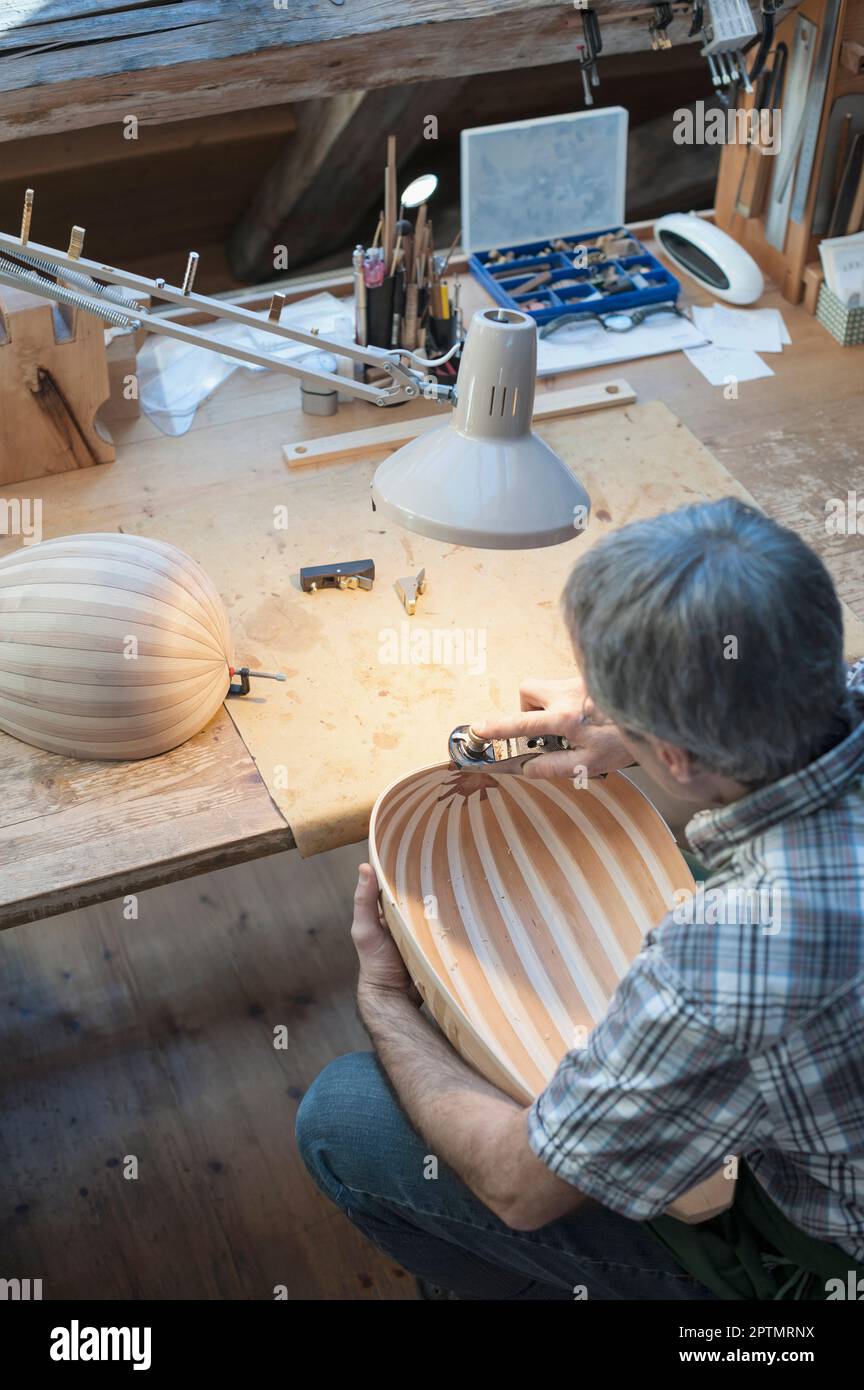 Craftsman manufacturing lute at workshop Stock Photo - Alamy