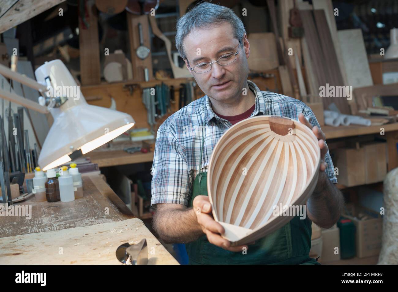 Craftsman manufacturing lute at workshop Stock Photo - Alamy