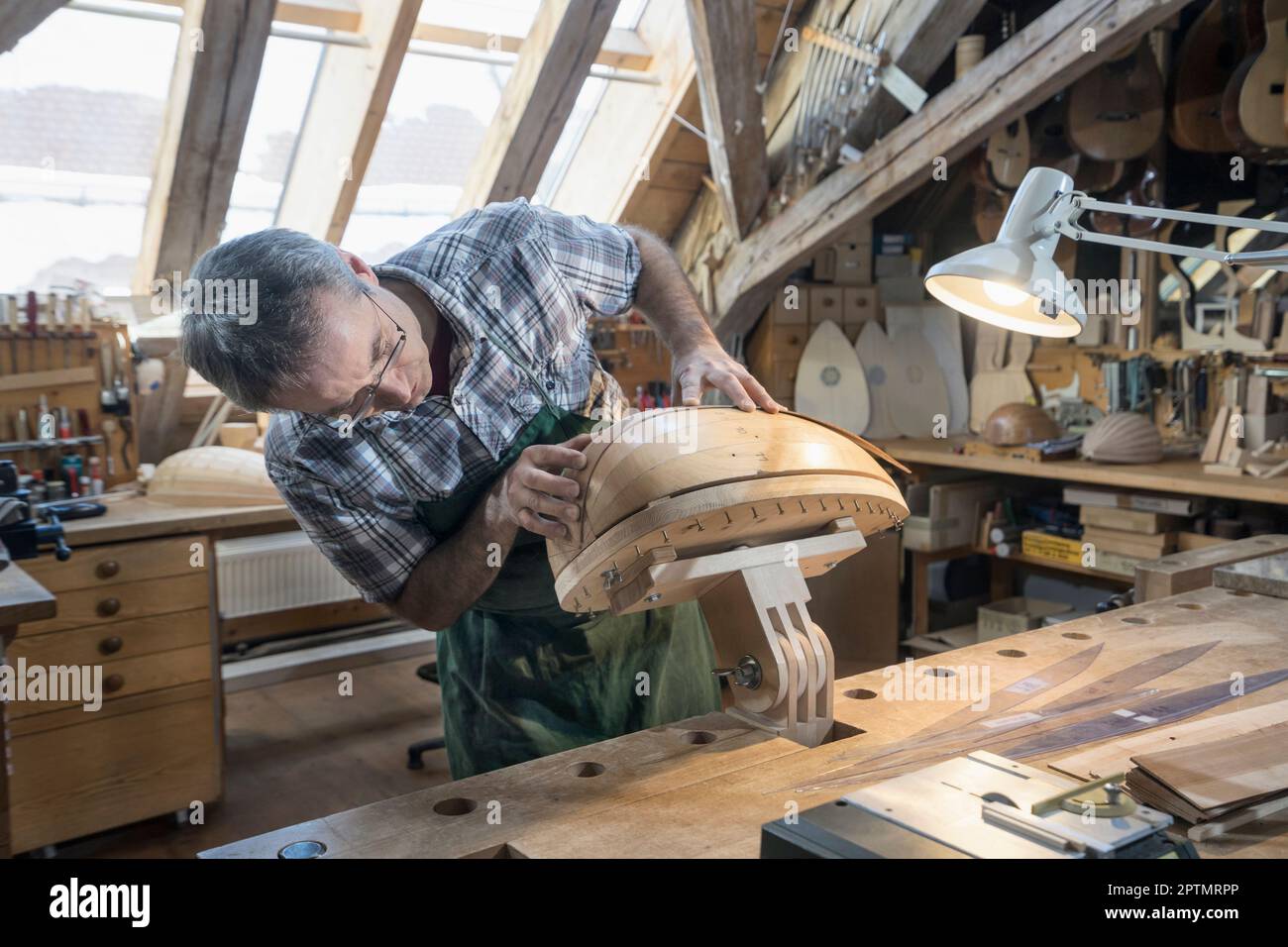 Craftsman manufacturing lute at workshop Stock Photo - Alamy
