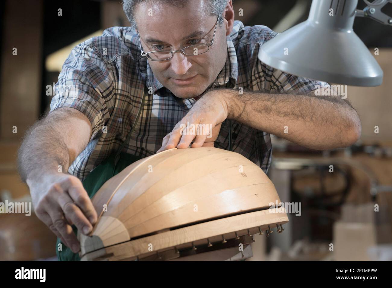Craftsman manufacturing lute at workshop Stock Photo - Alamy