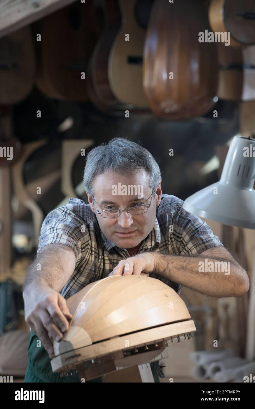 Craftsman manufacturing lute at workshop Stock Photo - Alamy