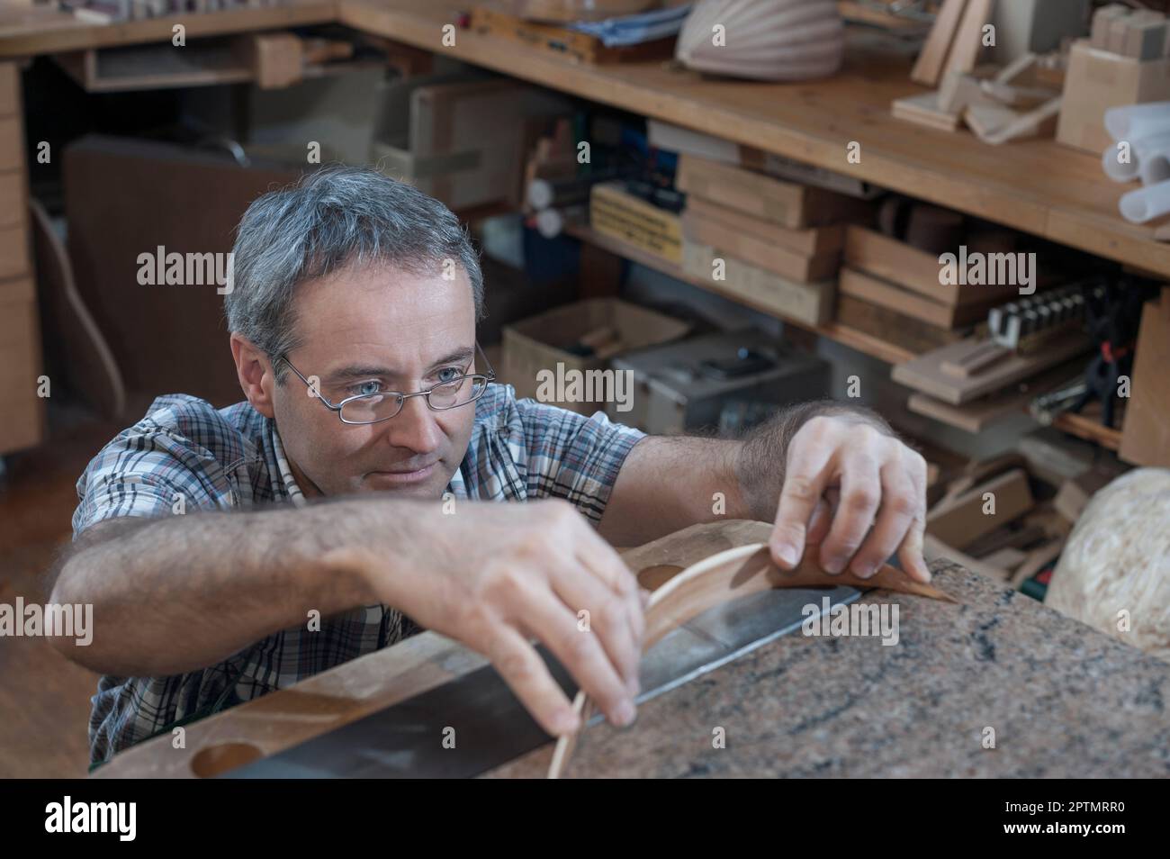 Craftsman manufacturing lute at workshop Stock Photo - Alamy