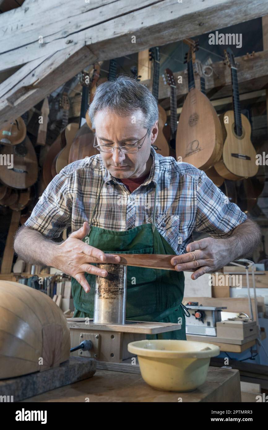 Craftsman manufacturing lute at workshop Stock Photo - Alamy