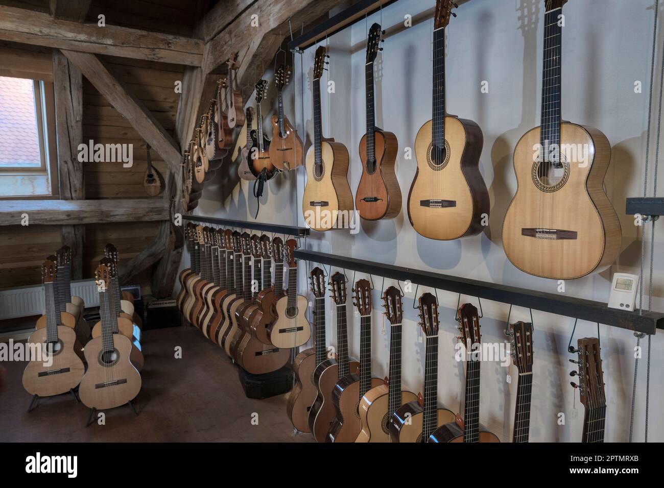 Guitars on display at music store Stock Photo - Alamy