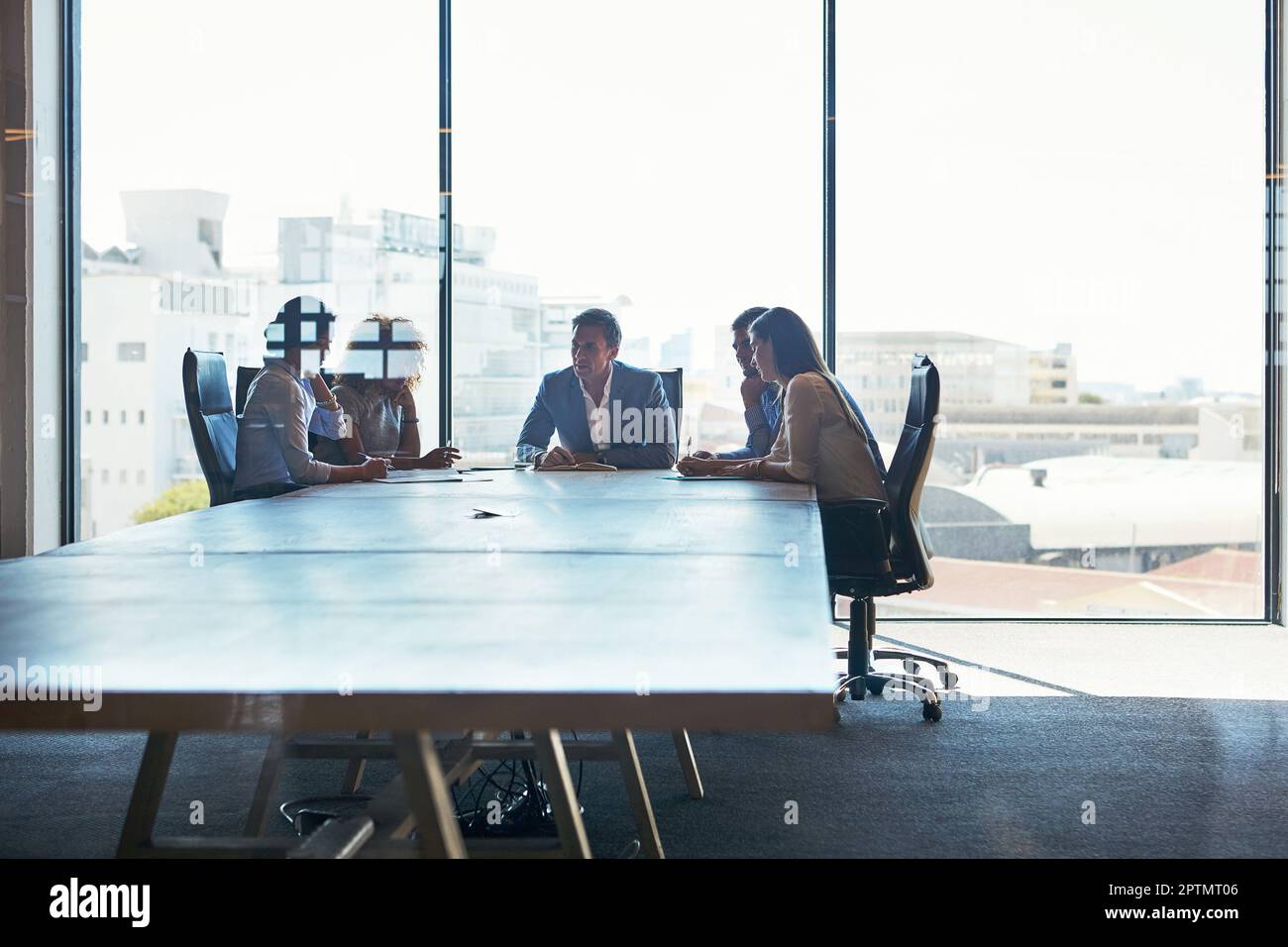 Going over their plan of action in the boardroom. Full length shot of a ...