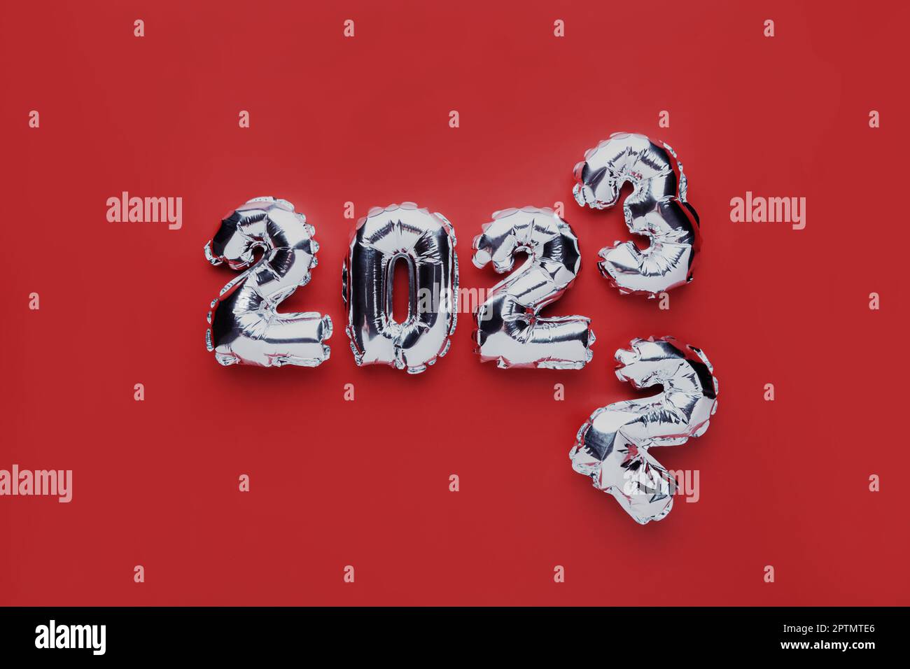 Christmas or New Year background. Red color flat lay with silver shiny ...