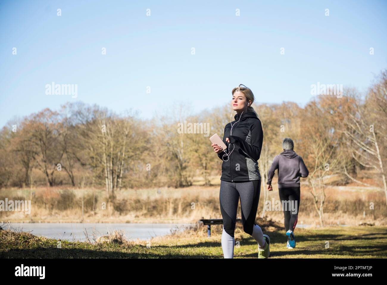 Two people jogging on trail hi-res stock photography and images - Alamy