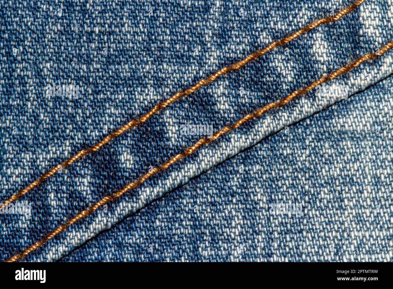 Blue jeans texture background and button and seam Stock Photo - Alamy