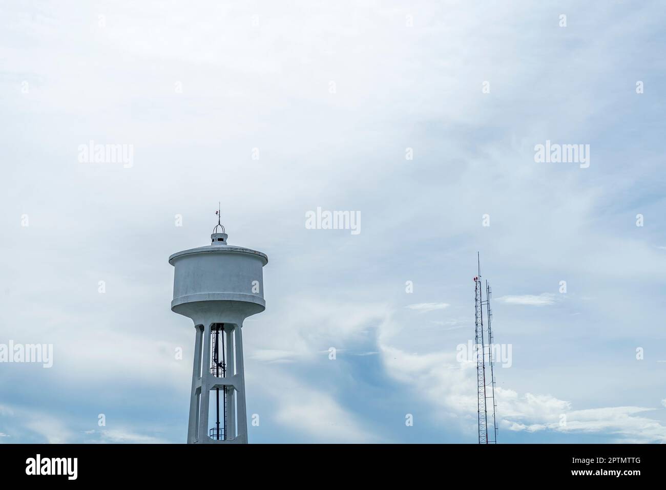Water tank and signal towers and sky and clouds background Stock Photo ...
