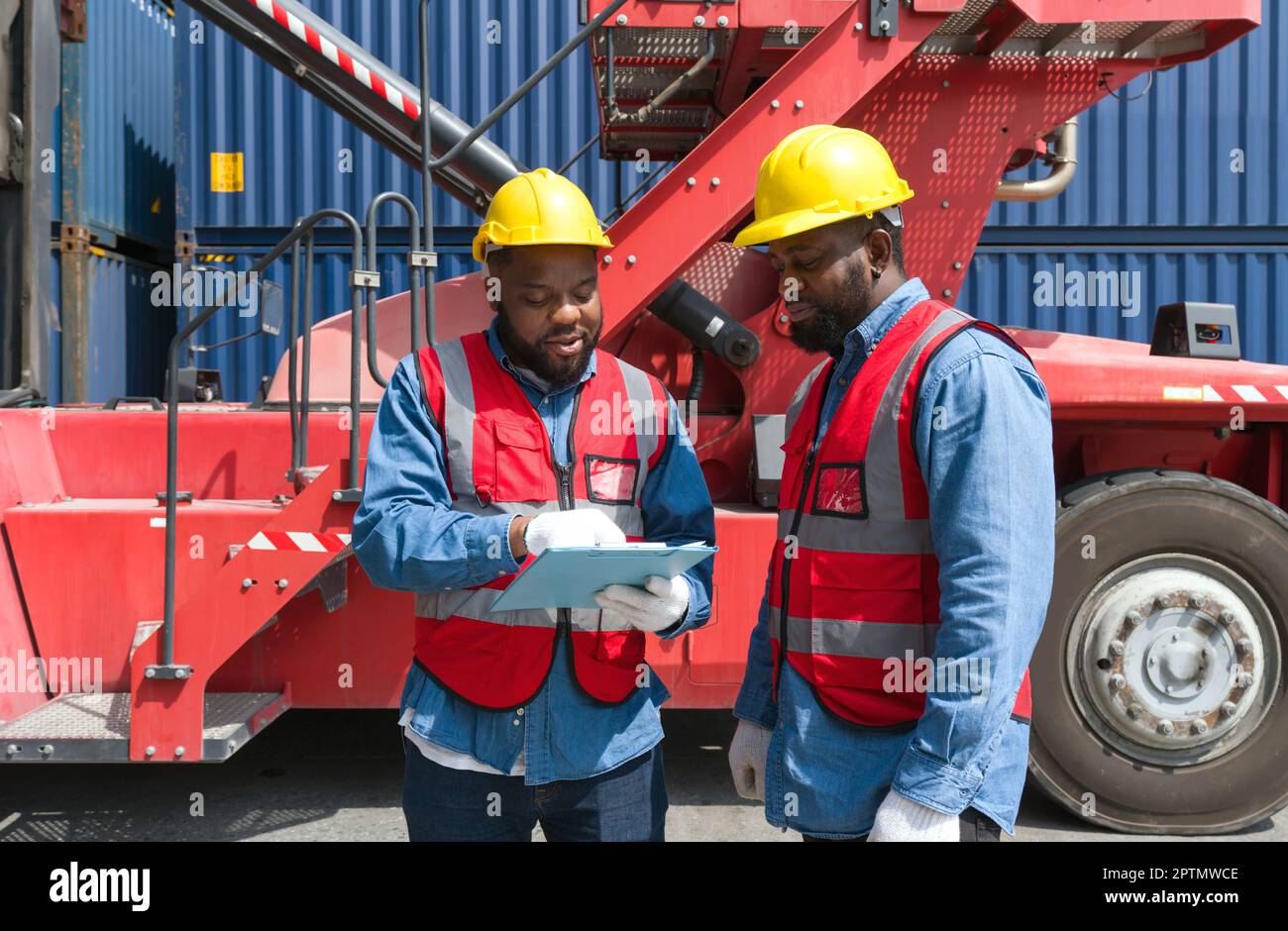 Two short black hair man with moustache and beard dressed in hardhat ...