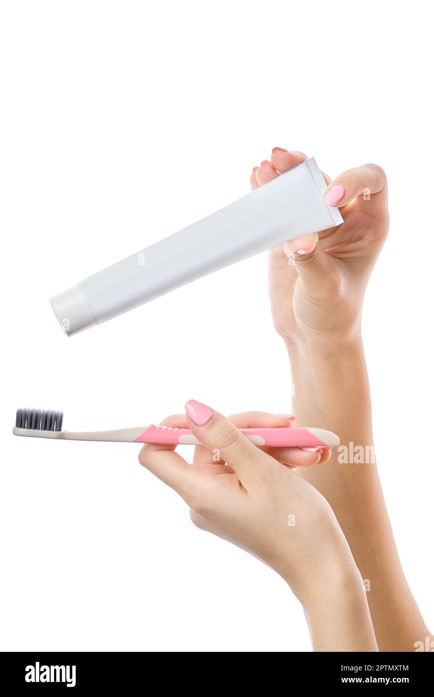 Female hands with toothbrush and paste isolated on white background ...