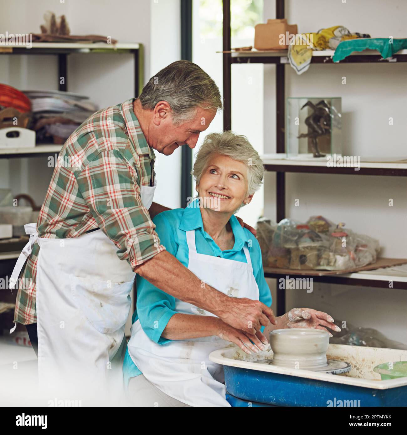 Living life on love and creativity. a senior couple making a ceramic ...