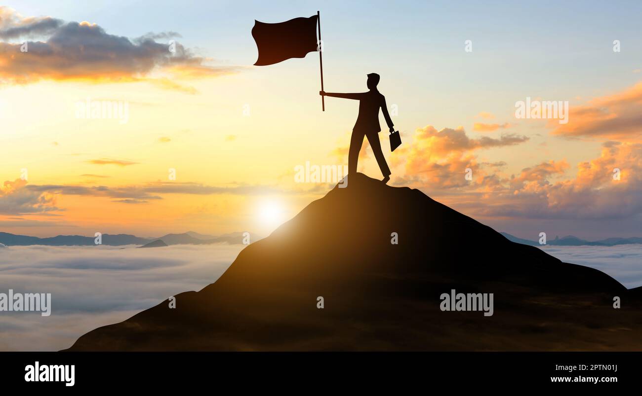 Silhouette businessman with flag climbed to the top of mountain over ...
