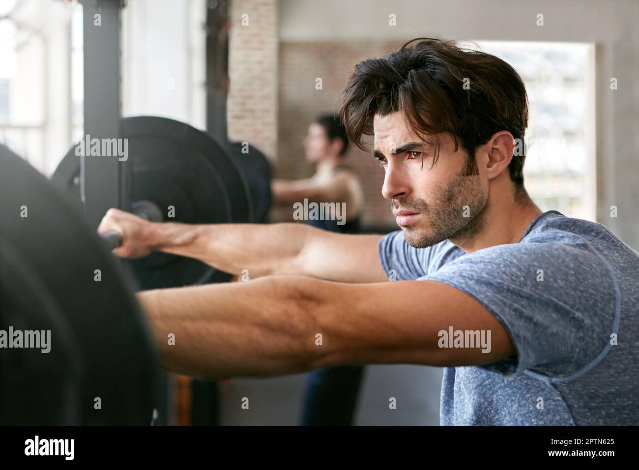 Get serious and get fit. a young athlete looking tired after working ...