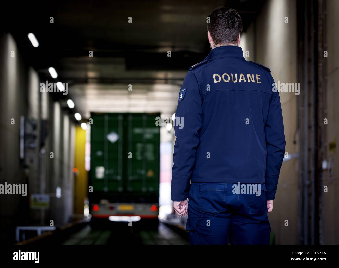 ROTTERDAM - A customs officer of the Port of Rotterdam Customs in a ...
