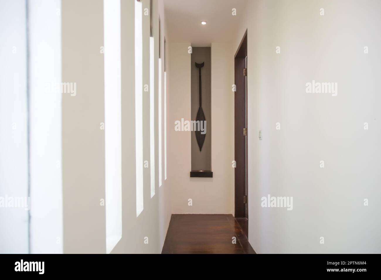 Modern white narrow hallway with windows on the side wall Stock Photo ...