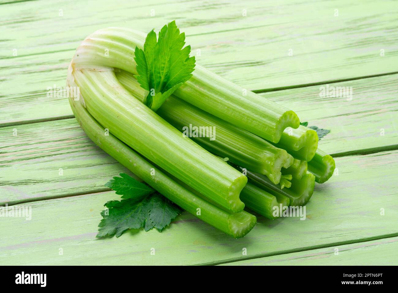 Pile of celery ribs isolated on white background Stock Photo - Alamy
