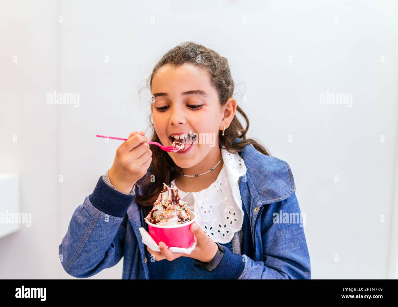 happy girl eating ice cream Stock Photo - Alamy