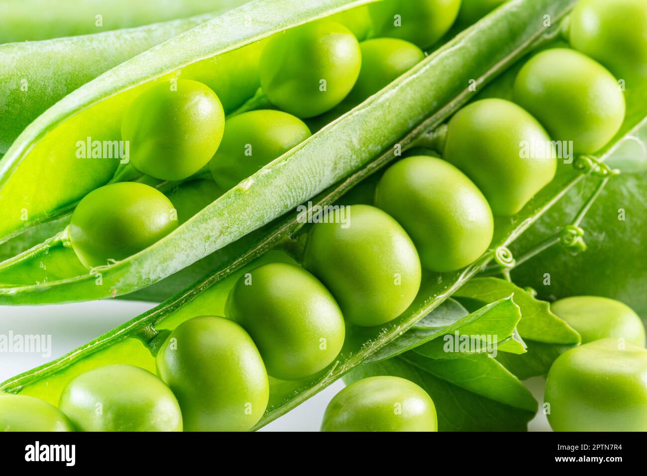 Perfect green peas in pea pods close up. Food background Stock Photo ...