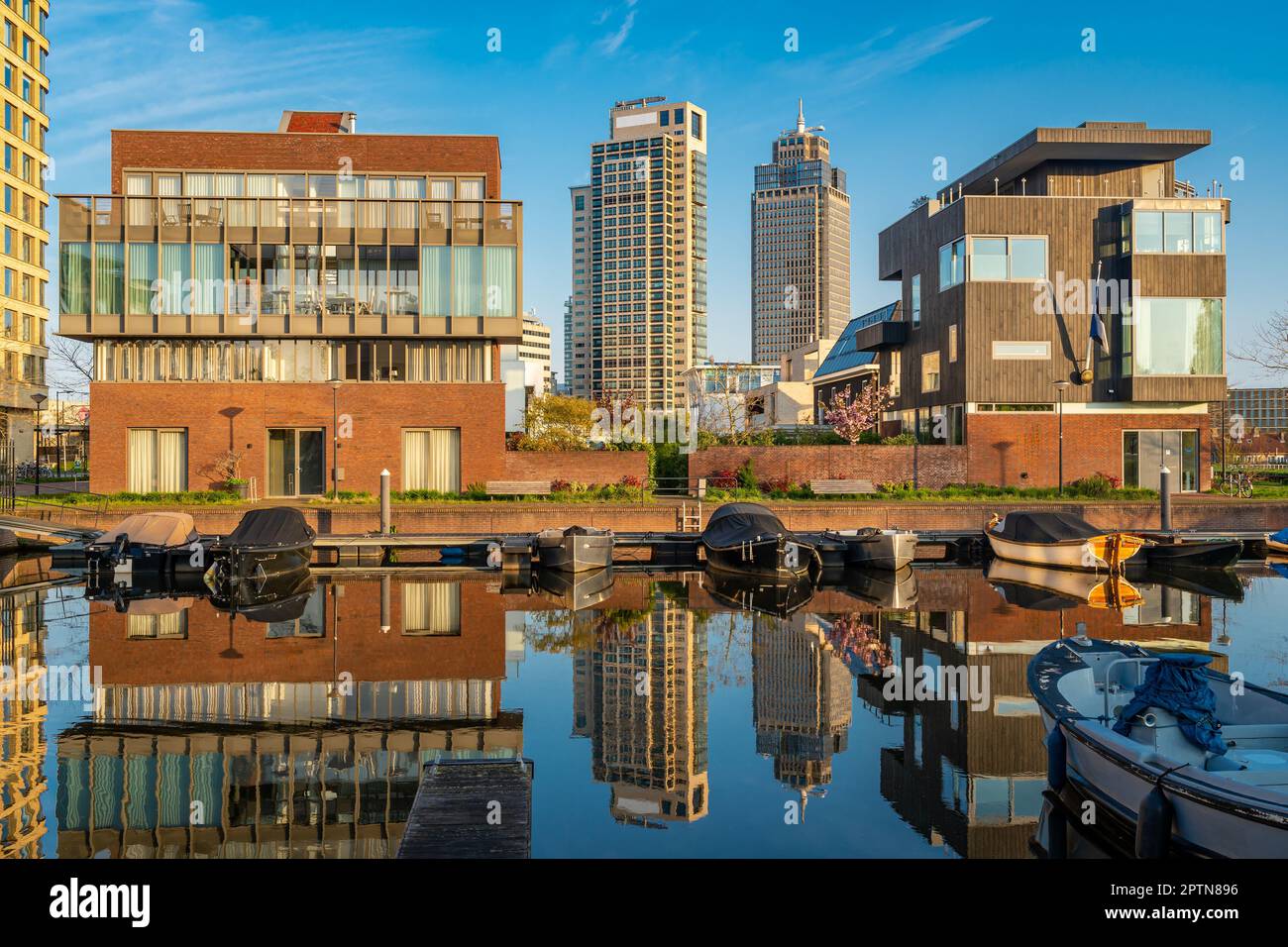 Tallest skyscrapers of Amsterdam mirrored in the water, modern dutch ...