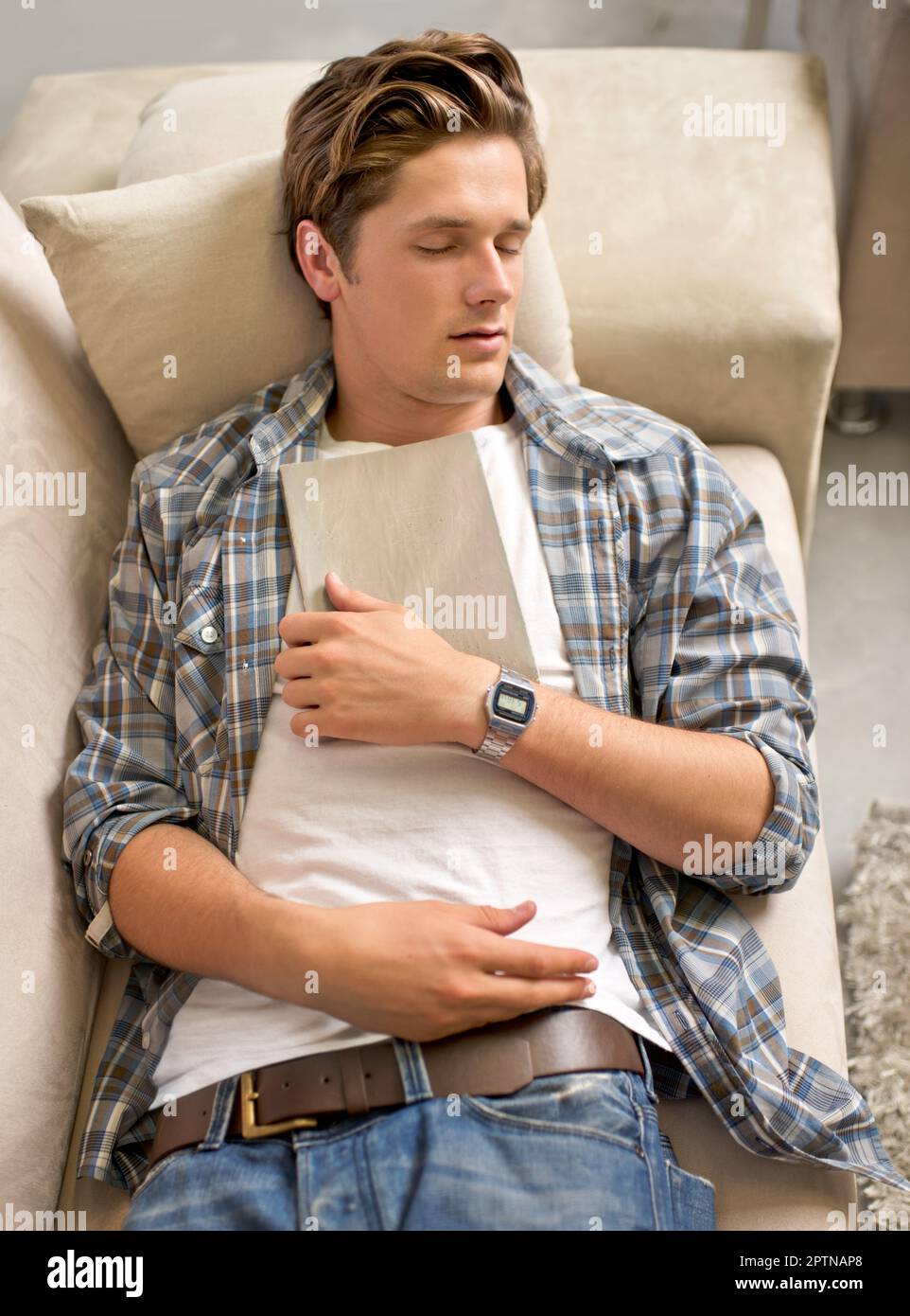 Man lounging on sofa lazy hi-res stock photography and images - Alamy