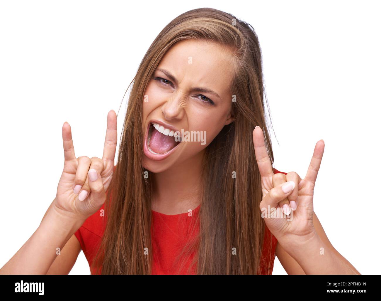 Rock on. an attractive young woman giving the rock and roll sign Stock ...