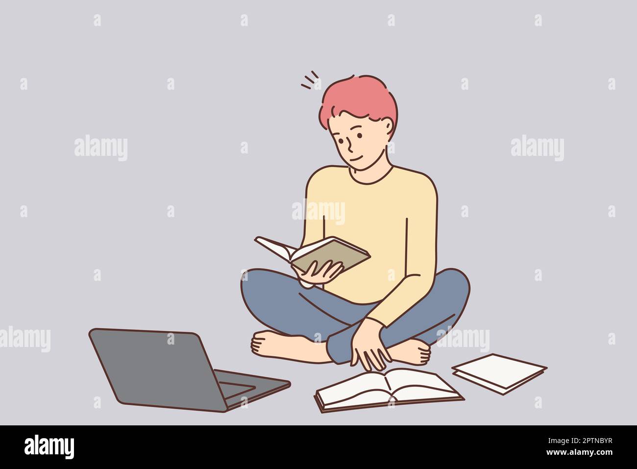 Young man sit on floor study with books using laptop. Smiling guy ...