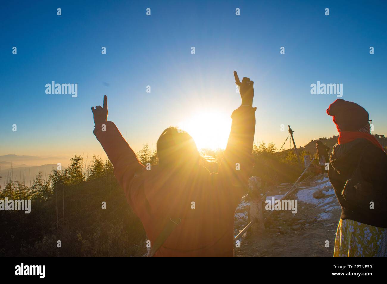 Morning sunlight back-lit silhouette unidentified happy man with arm ...