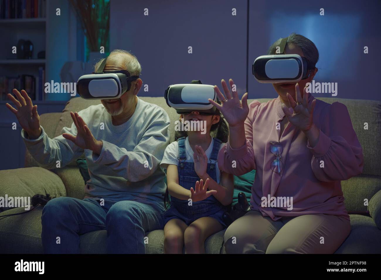 Asian elderly with child play VR video game, family entertainment ...