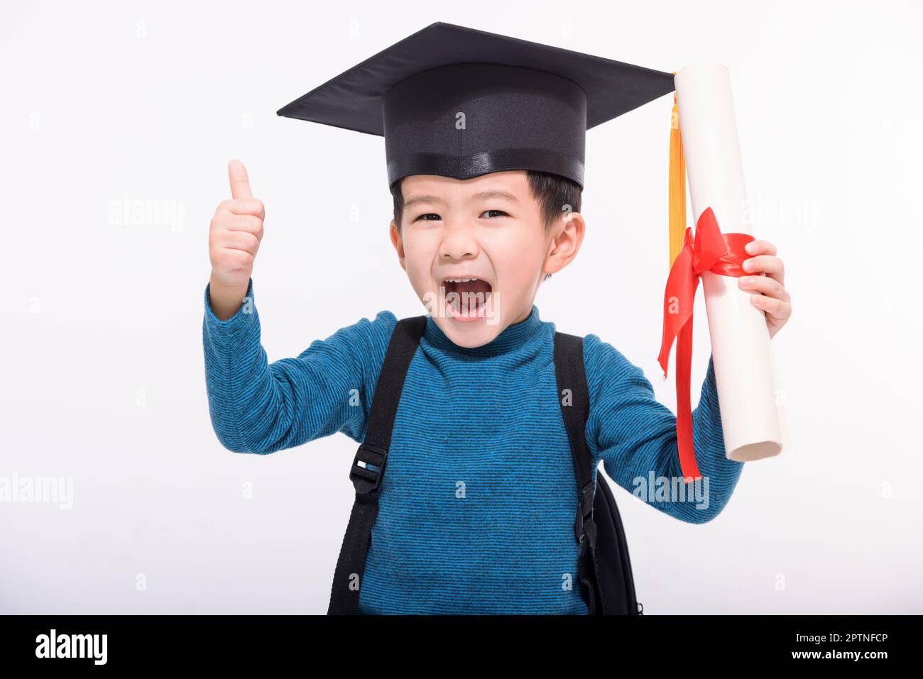 Happy graduate boy student showing the diploma and thumbs up Stock ...