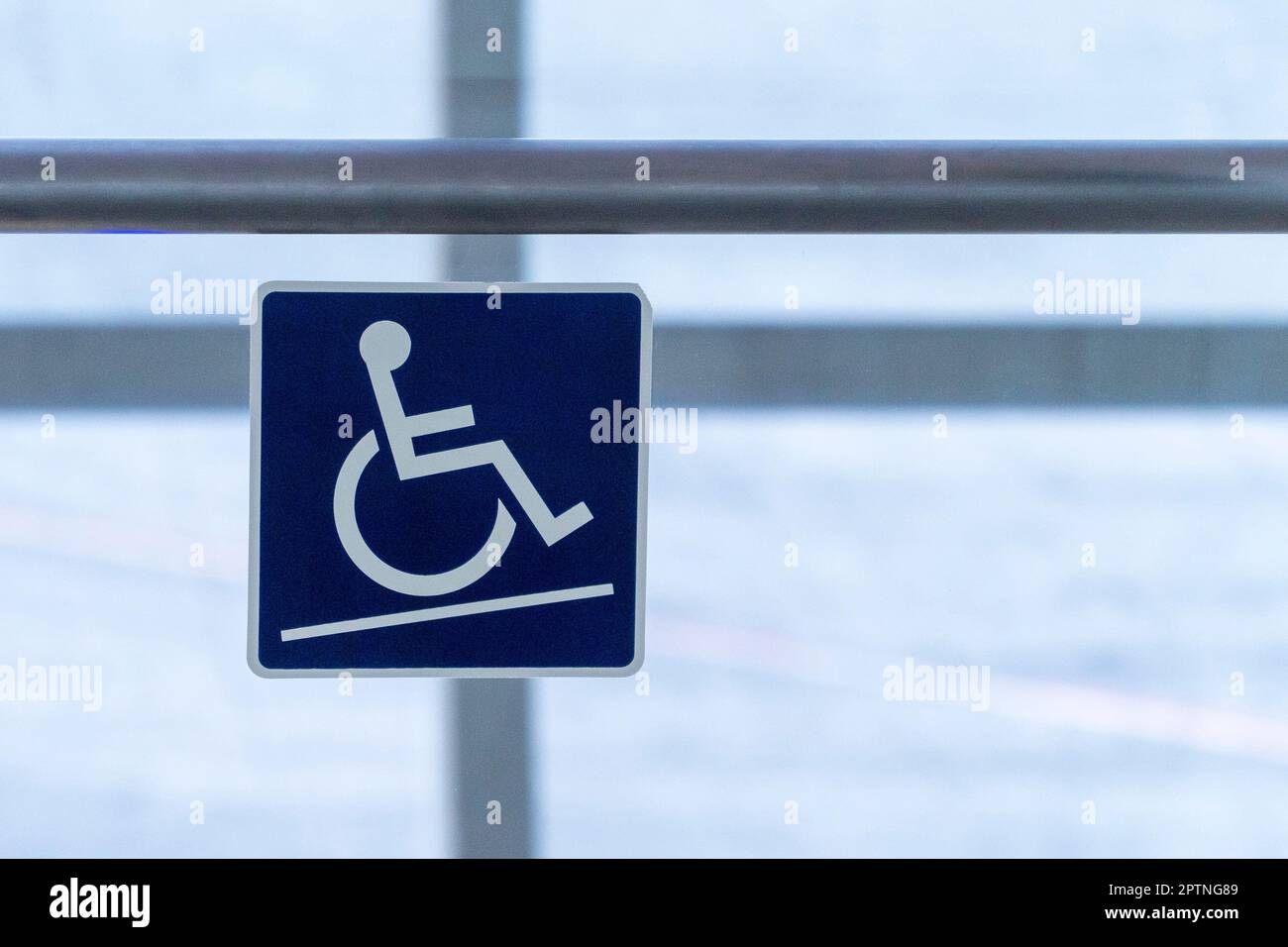 Disabled sign Tilted floor warning wheelchair care Stock Photo - Alamy
