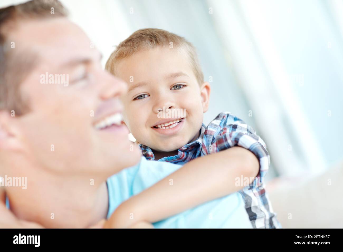 Hi, daddy. a young father and his son relaxing together at home Stock ...