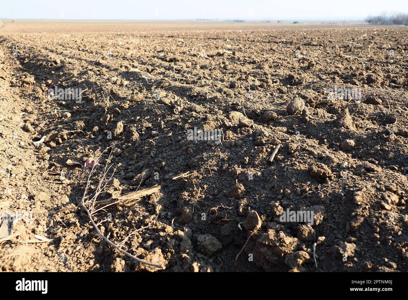 Arable field ready for spring agricultural work. Furrows from the ...