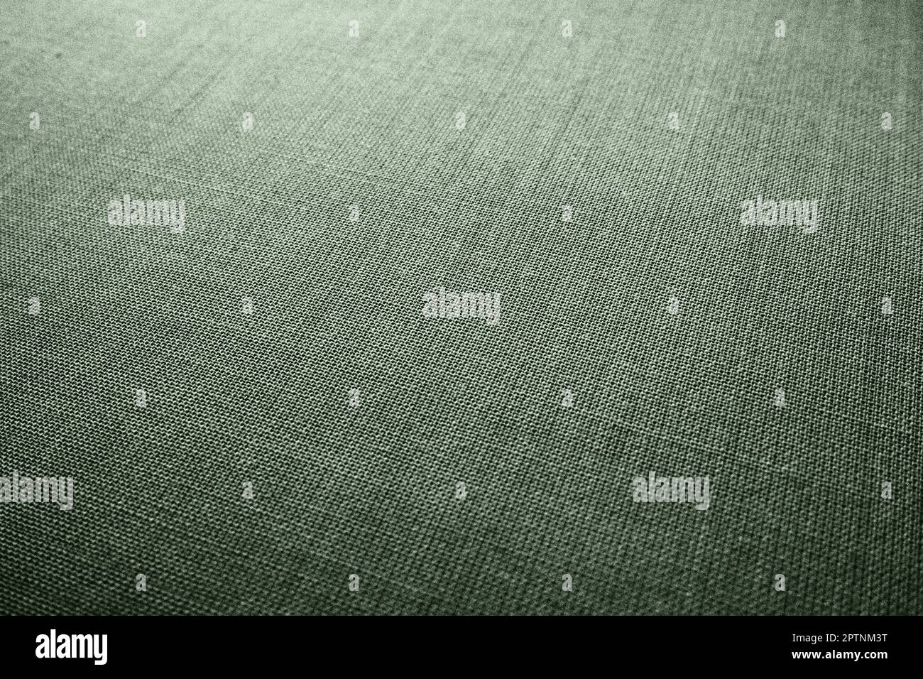 green background fabric texture. A piece of woolen cloth is neatly laid ...