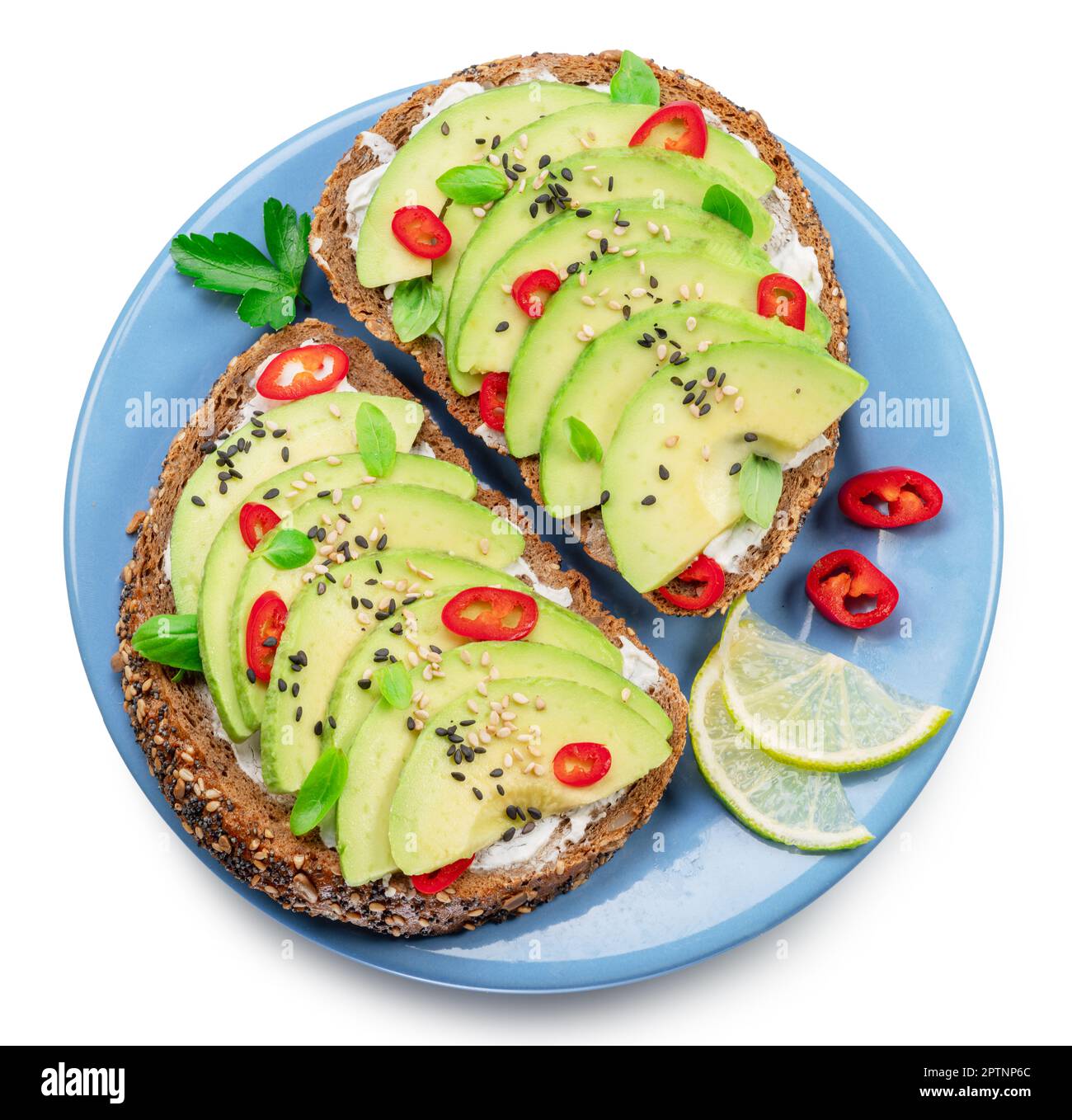 Avocado toasts - bread with avocado slices, pieces of chilli pepper and ...