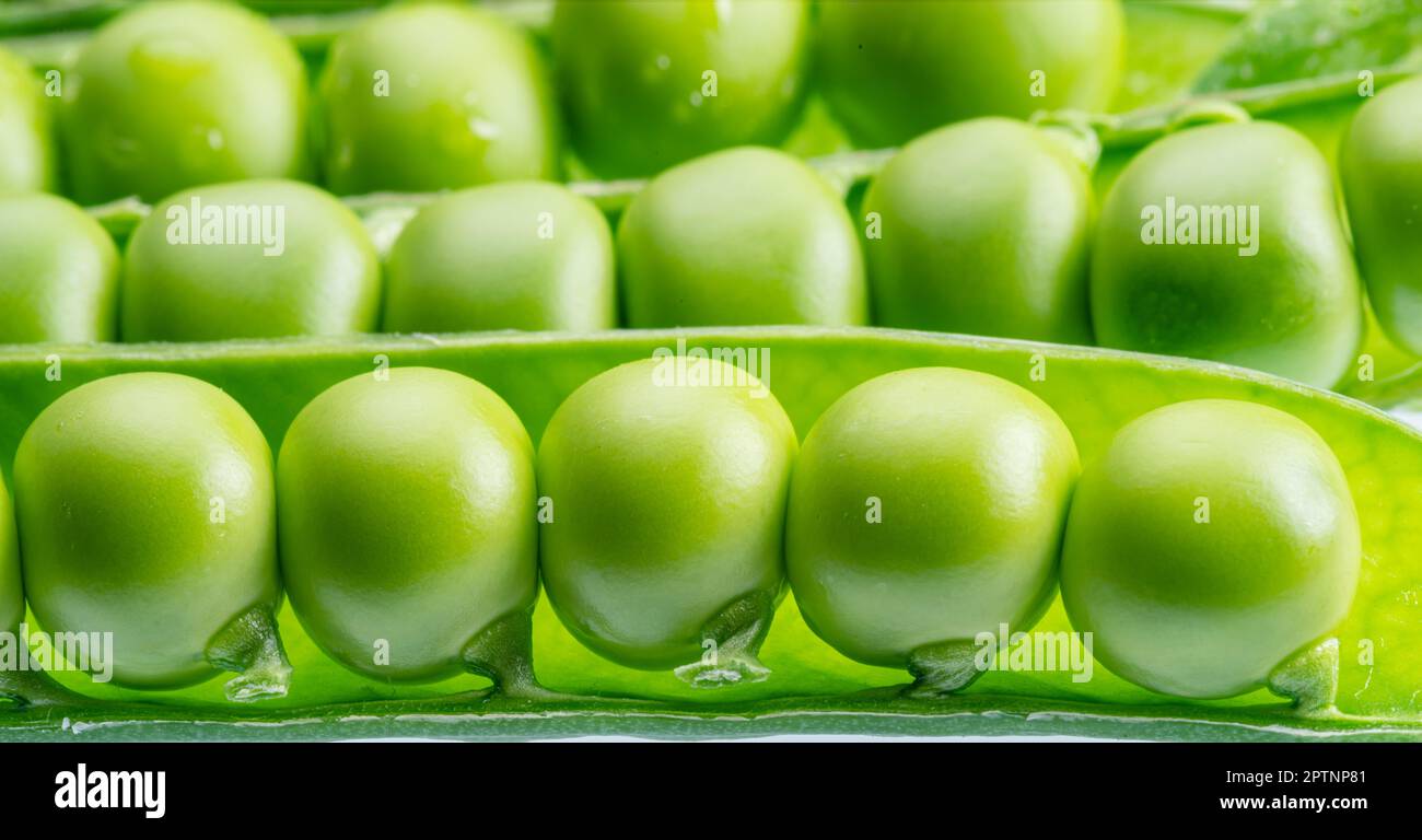 Rows of perfect green peas in pod close-up. Food background Stock Photo ...