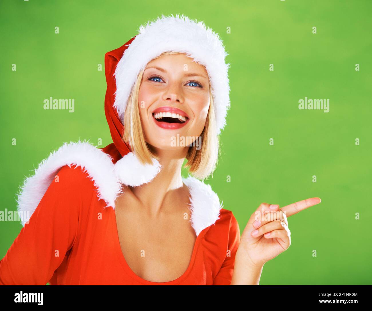 Wow, Christmas and woman in studio pointing to marketing, advertising ...