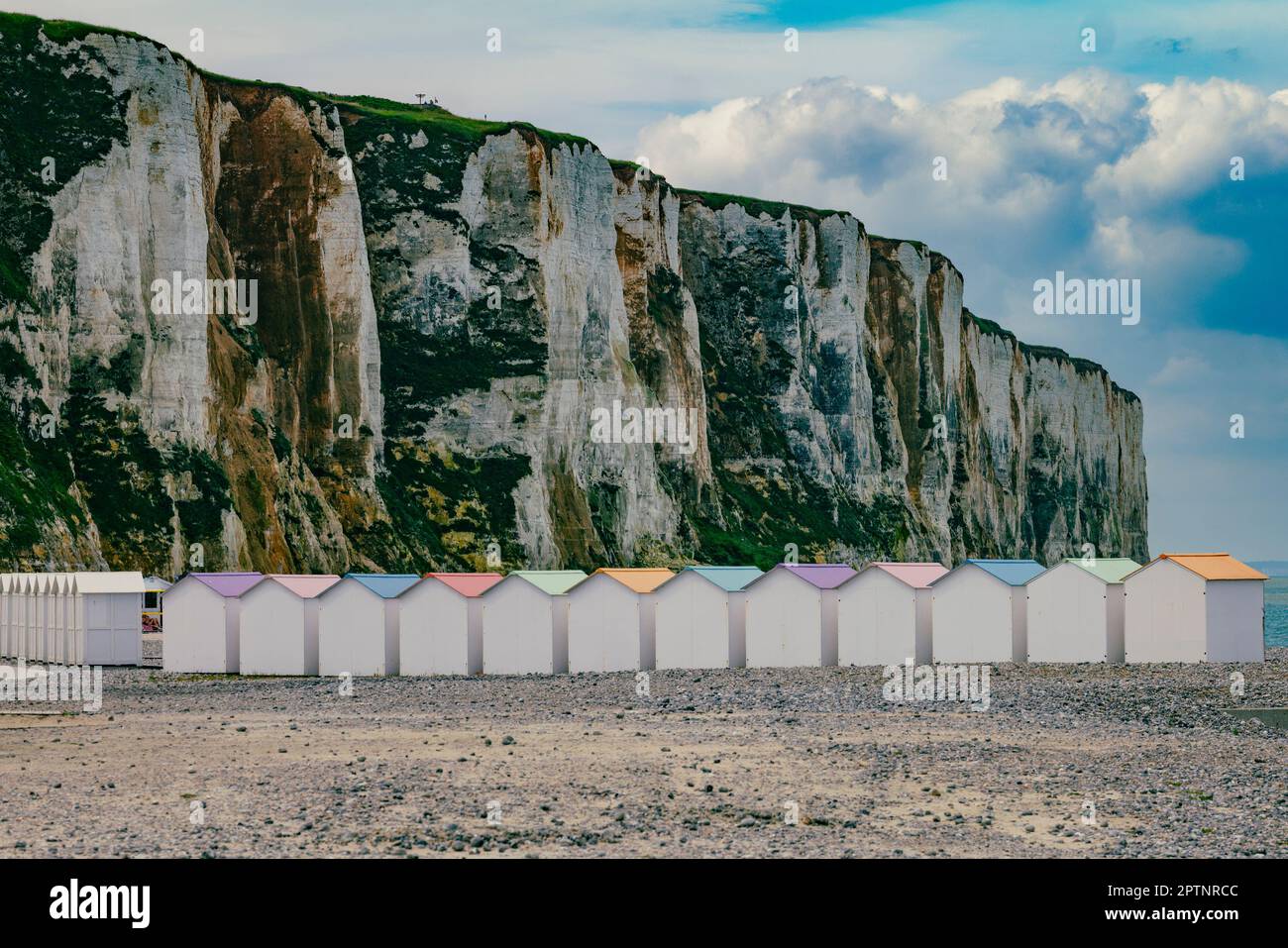 Beach cabins with colored roofs at the foot of the cliffs Stock Photo ...