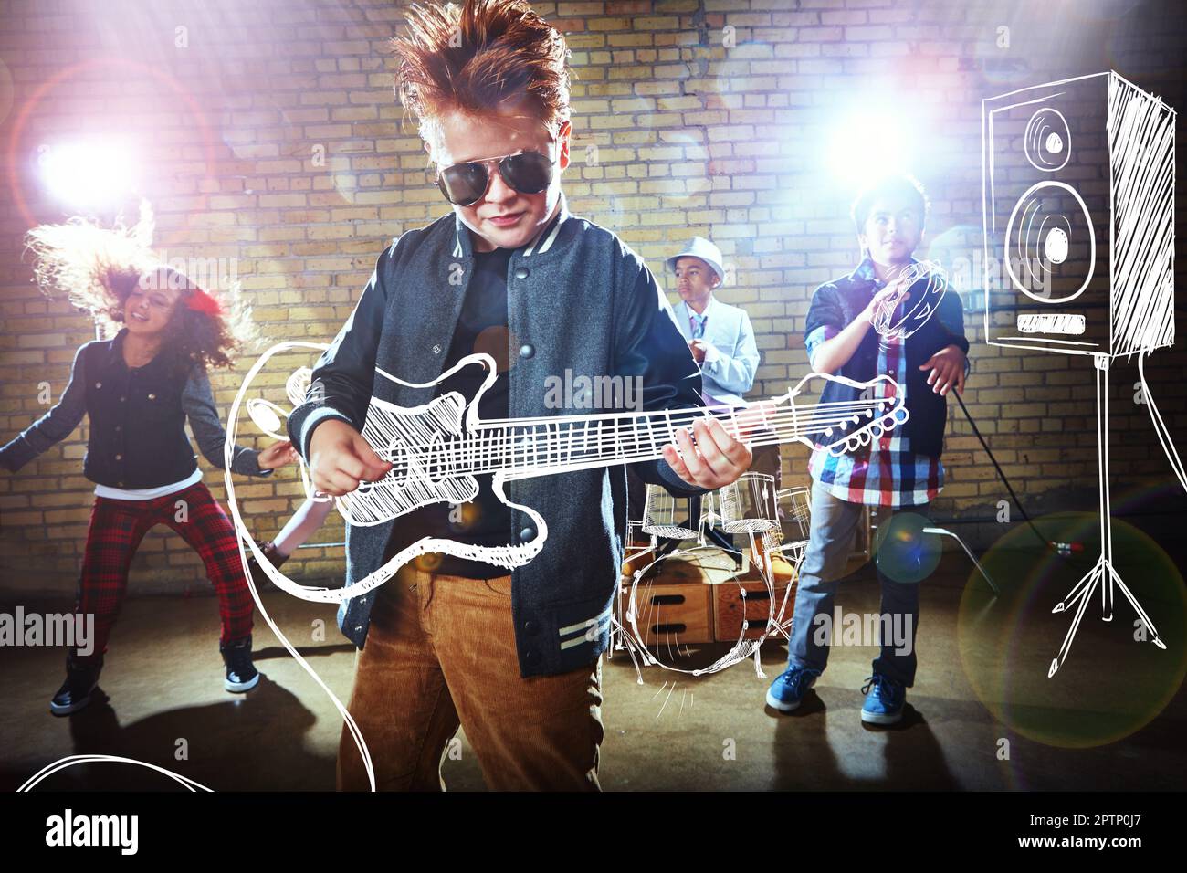 Playing with a rockstar attitude. children playing rock music on ...