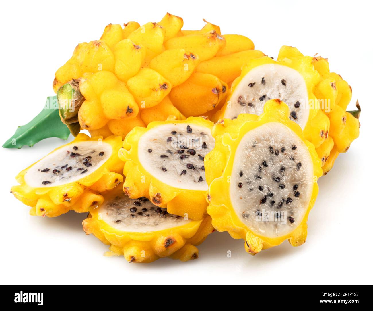 Yellow dragon fruit and dragon fruit slices and leaves isolated on ...