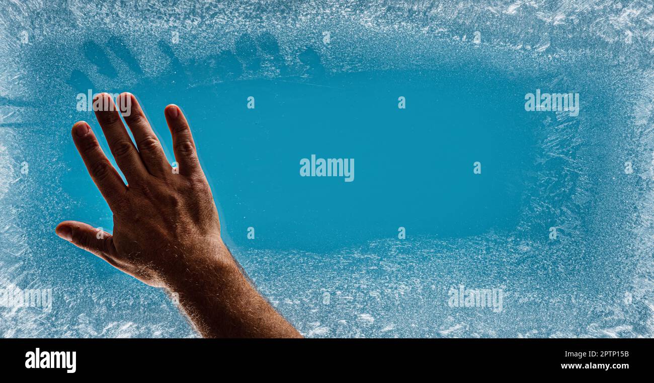 Frost patterns on frozen winter window as a symbol of Christmas wonder ...