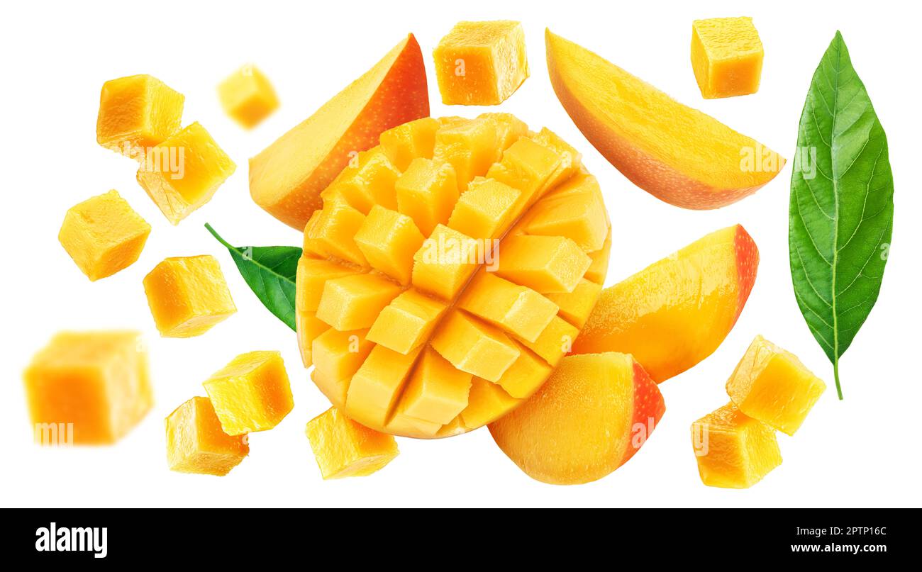 Mango fruit slices and mango cubes flying isolated on white background ...