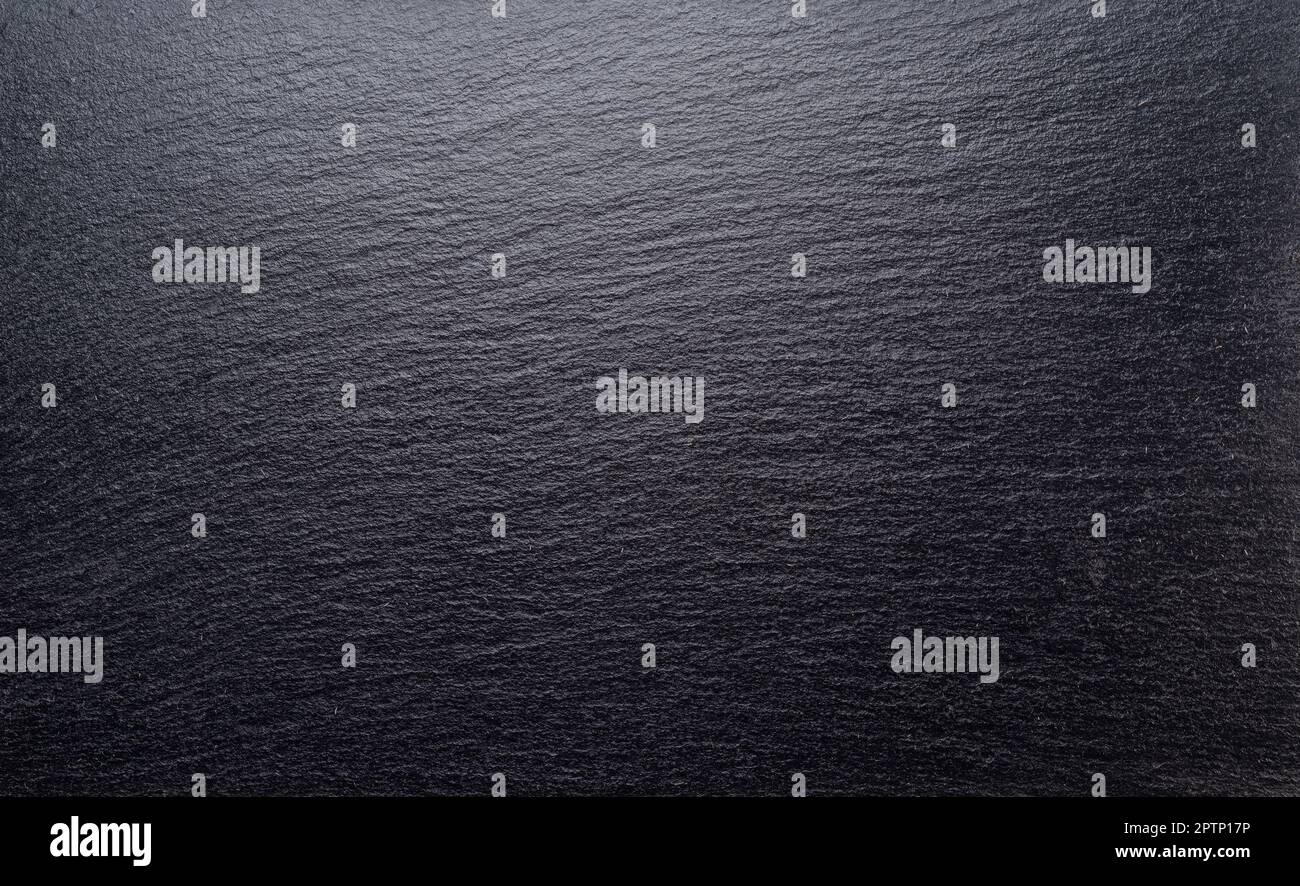 Natural stone black slate serving plate background Stock Photo - Alamy