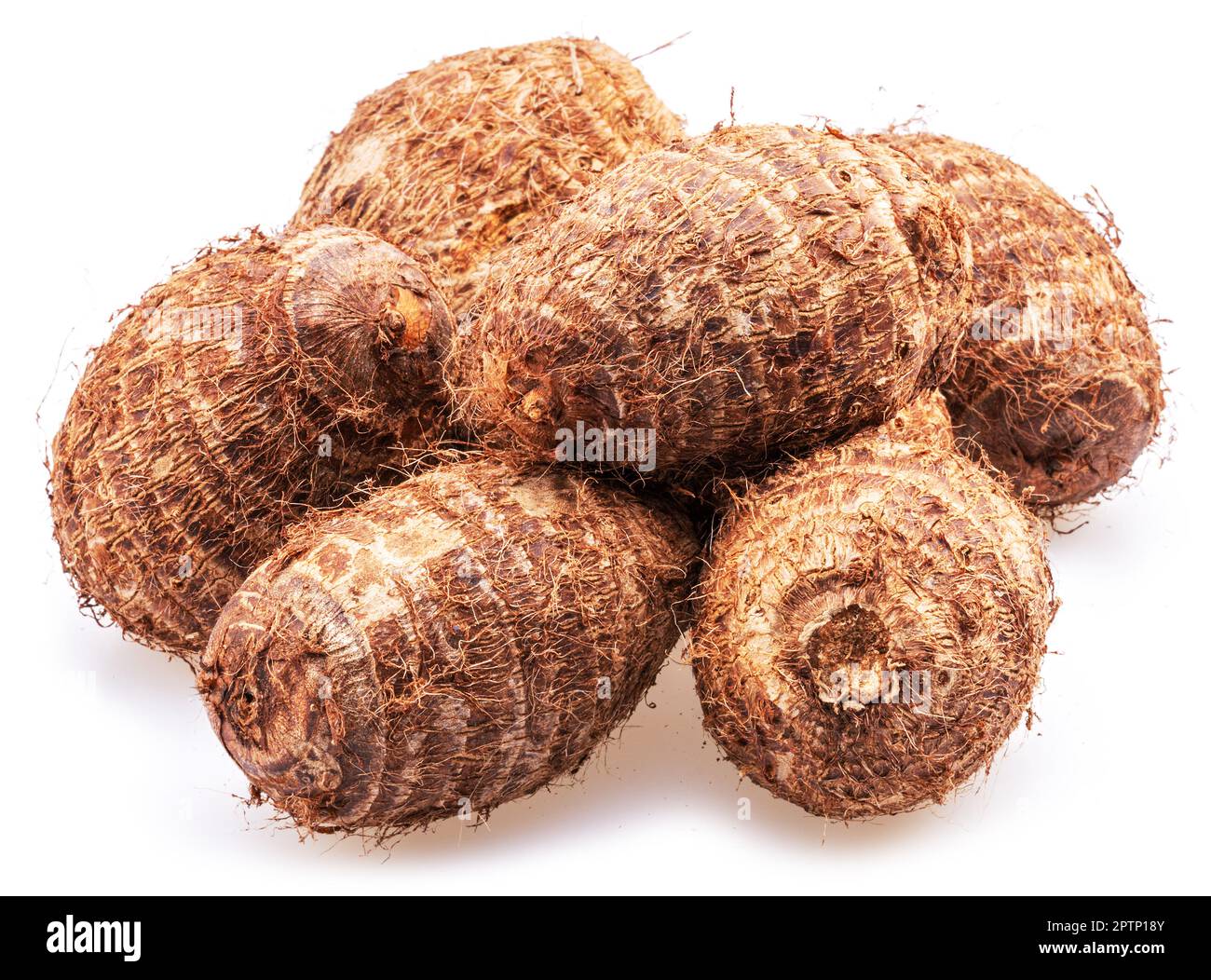 Eddoe or taro tubers isolated on white background Stock Photo - Alamy