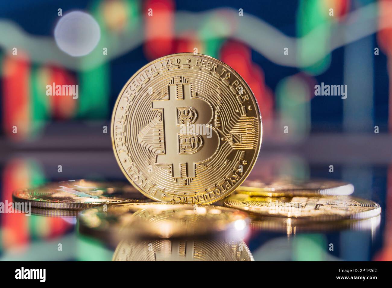 Bitcoins with background with red and green digital crypto candlesticks ...