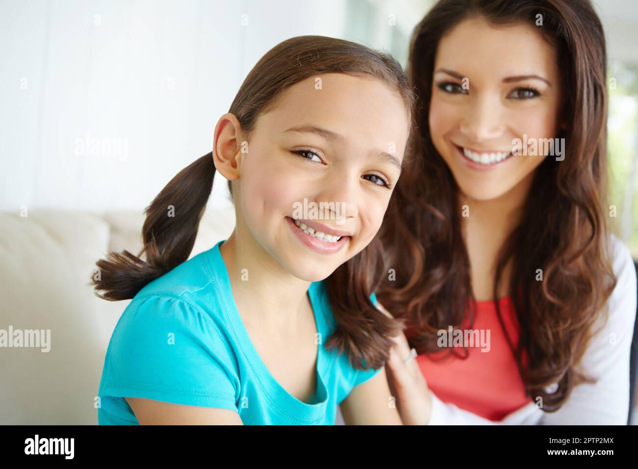 A mothers love. Portrait of a smiling pretty daughter with her pretty ...