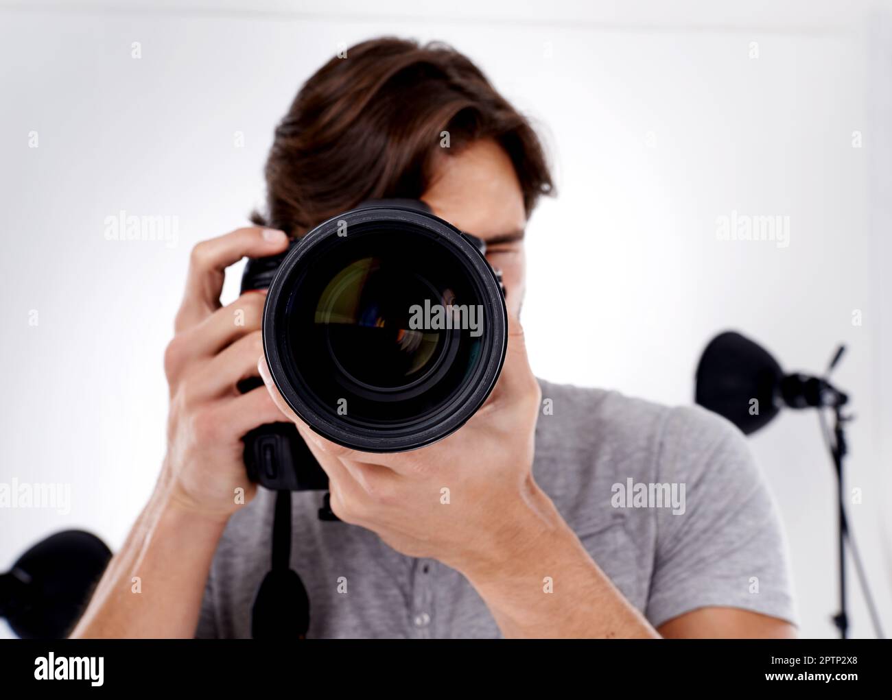 Ready for your close-up. A photographer aiming his camera at you Stock ...