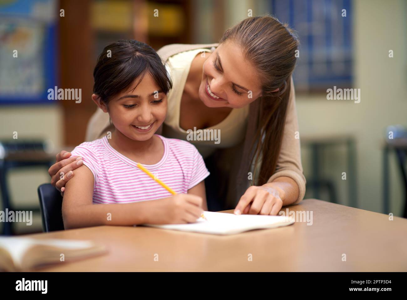 Teacher helping student homework in hi-res stock photography and images ...